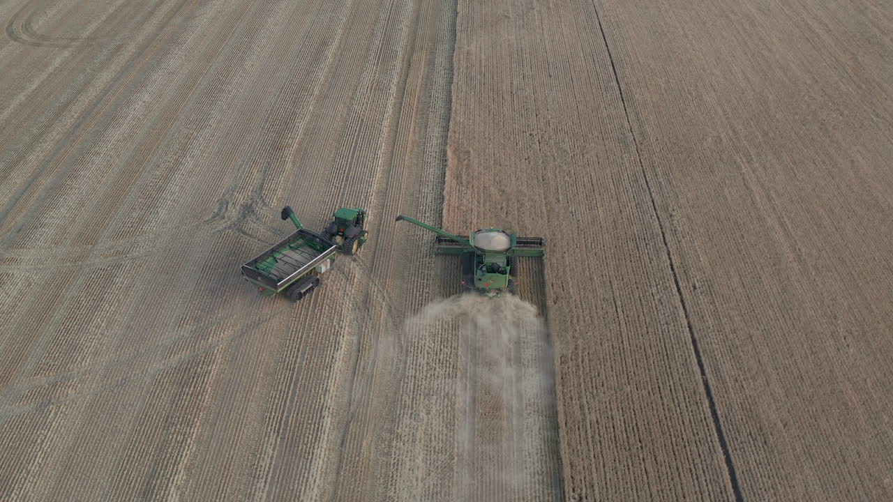Drone View Of Grain Cart Tractor Pulling Into Position For Dumping Full ...