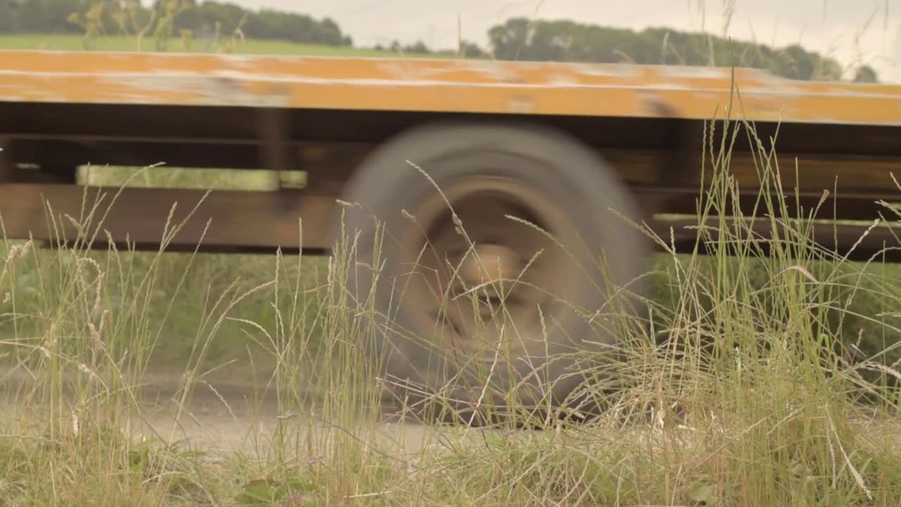 Tractor And Trailer Passes By On Country Road Free Stock Video Footage ...