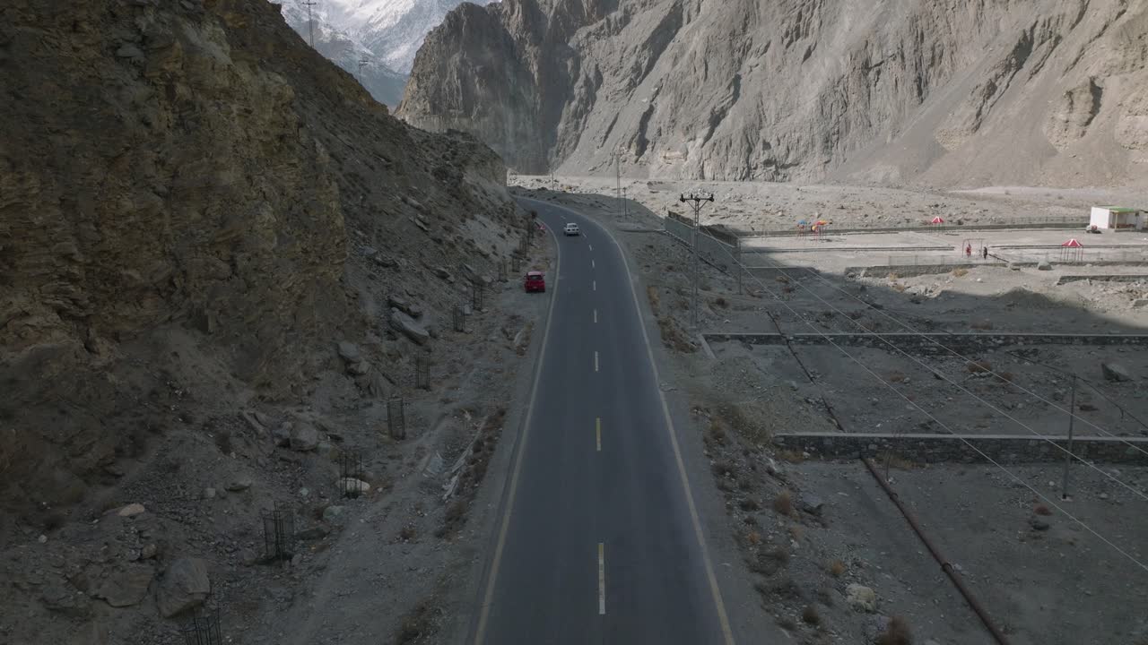 Car Driving Along Highway Into Horizon In Hunza Valley With Tilt Up ...