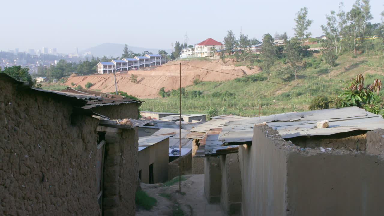 Tilt Down To Row Of Homes In A Slum Neighborhood Outside Kigali, Rwanda ...