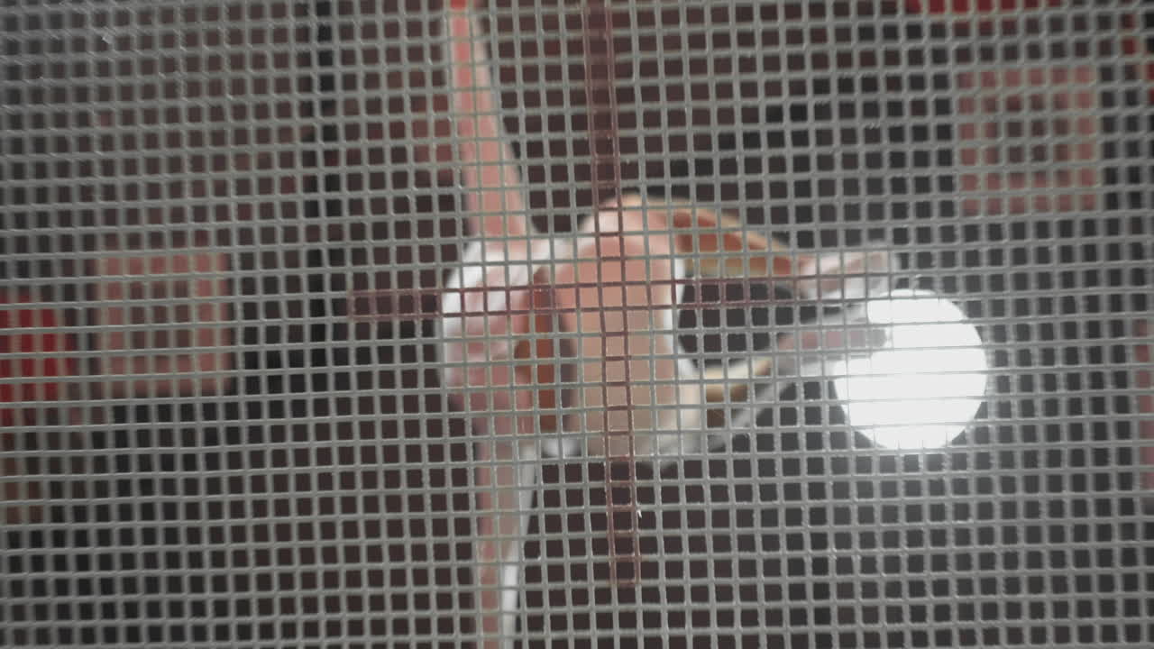 View From Below Through The Mesh Of The Trampoline Acrobats Jumping On ...