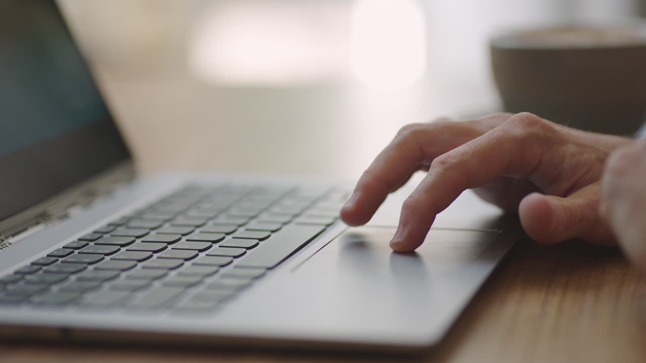 Close Up Hand Of Man Scrolling A Website Using Laptop Track Pad ...