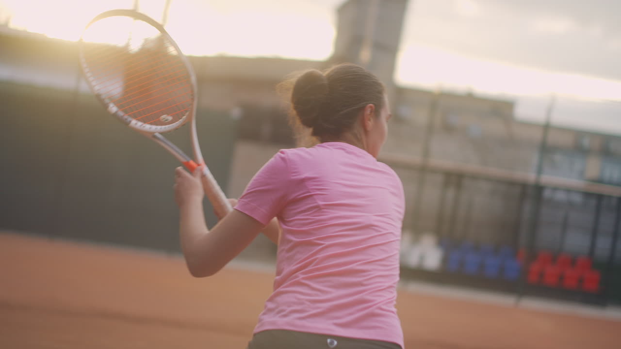 Slow Motion Commercial Footage Of Tennis Practice Through The Tennis ...