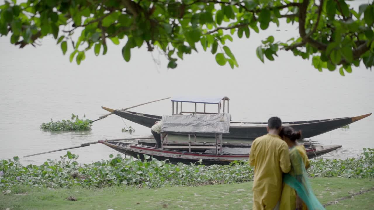 Indian Couple In Traditional Wear Standing Near River Bank Of Ganga, Rani Rashmoni Ghat, Boats ...