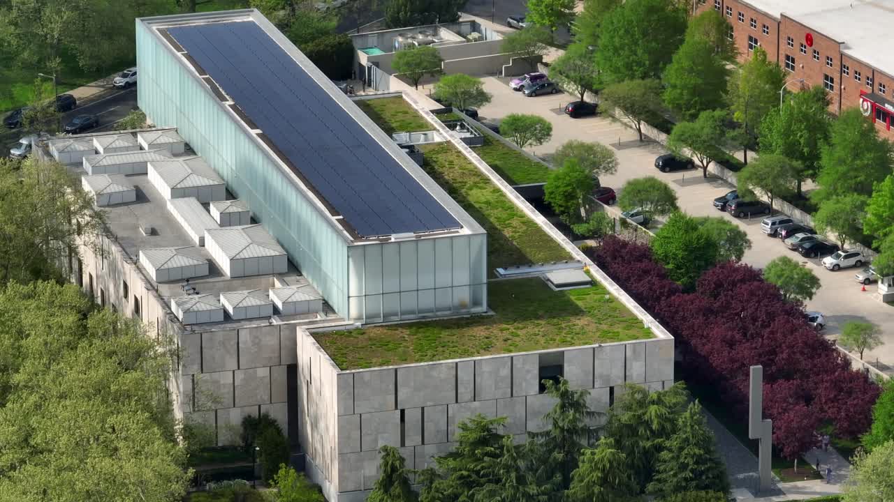 Long Aerial Zoom Of Solar Panels And Green Roof On Art Museum In ...