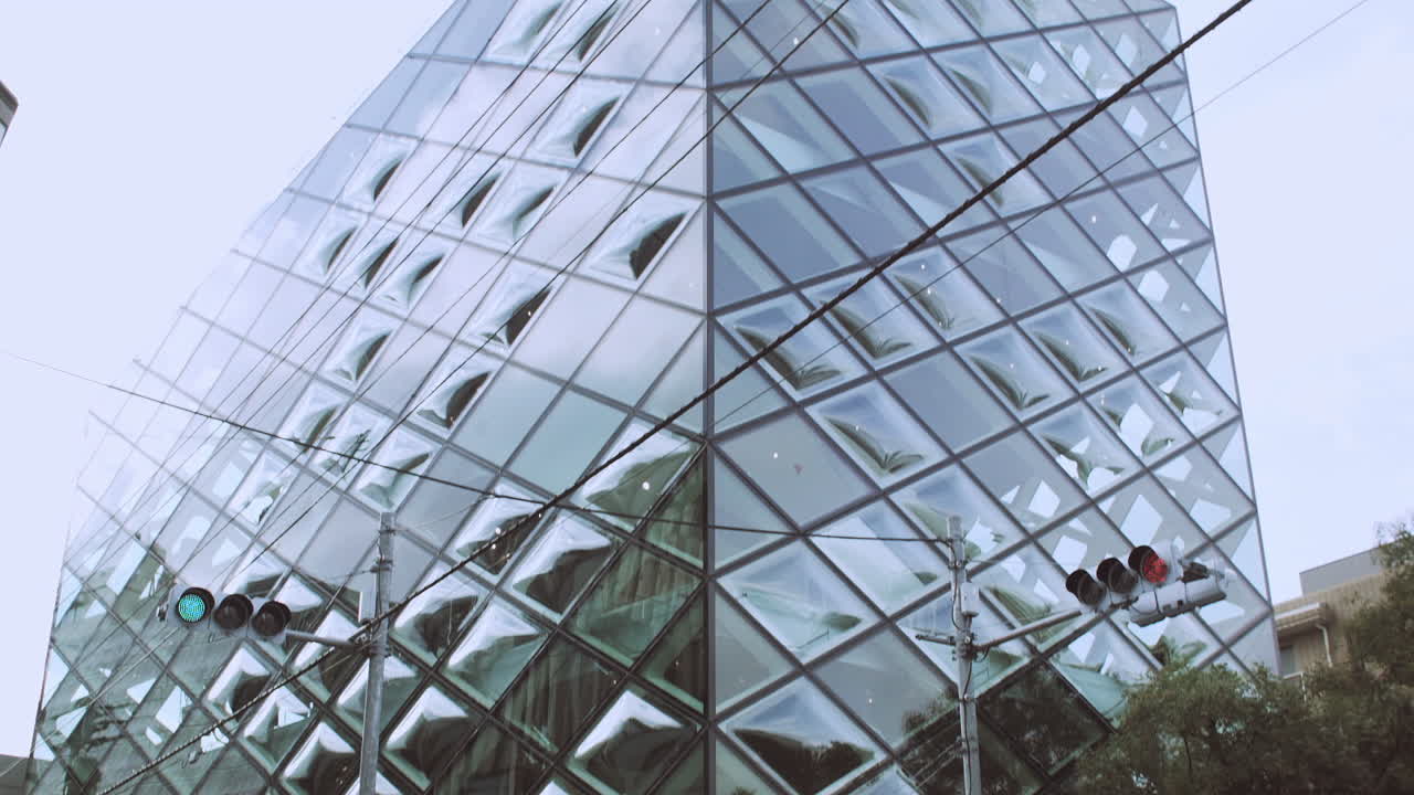 Tilt Up From Ground Level Street Traffic Up To Top Of Prada Glass ...