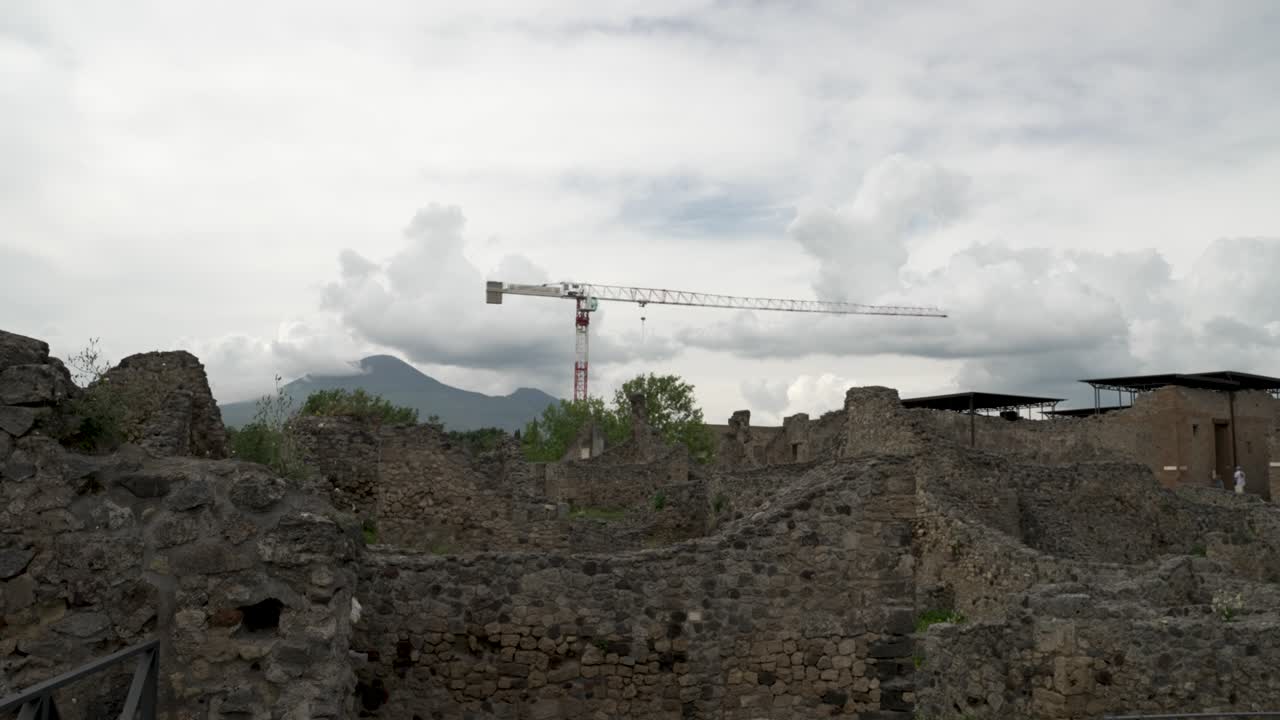 Construction Crane Seen In Background Of Ruins Of Pompeii With Mount ...