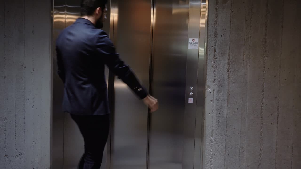 Various Shots Of Man Walking In And Out Of Elevator,checking Watch, Waiting For Someone Free ...