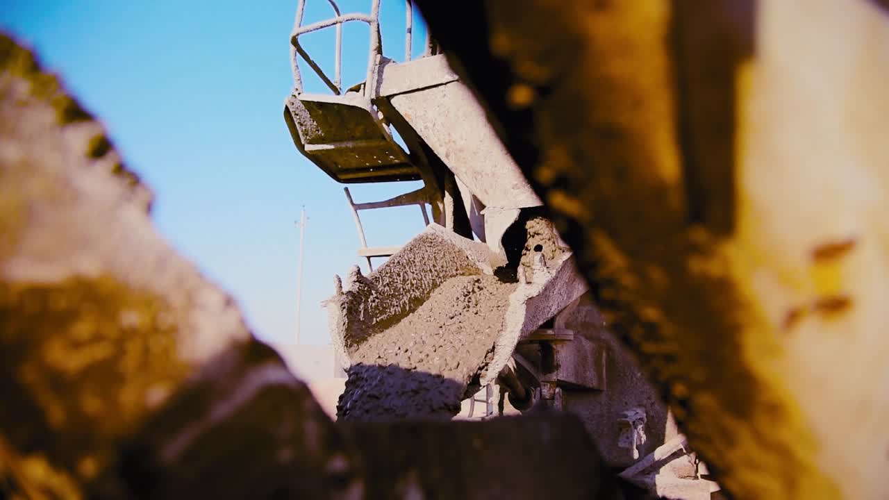 Premium stock video - Unloading the concrete truck at a construction ...