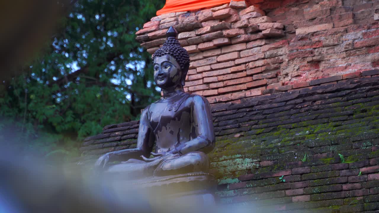 Sliding Reveal Of Buddha Statue Against Stone Temple Walls In Thailand ...