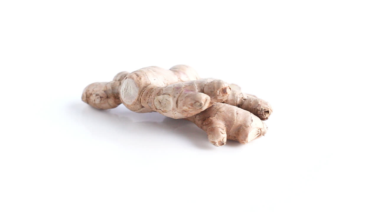 Premium stock video - Top shot a hand of ginger and slices rotating 360 ...
