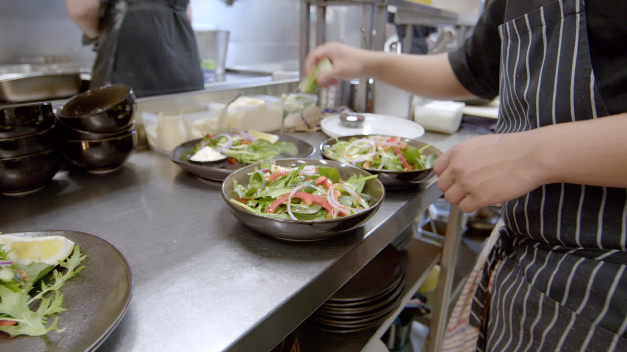 Premium stock video - Close-up shot of a chef dressing the beautiful salad