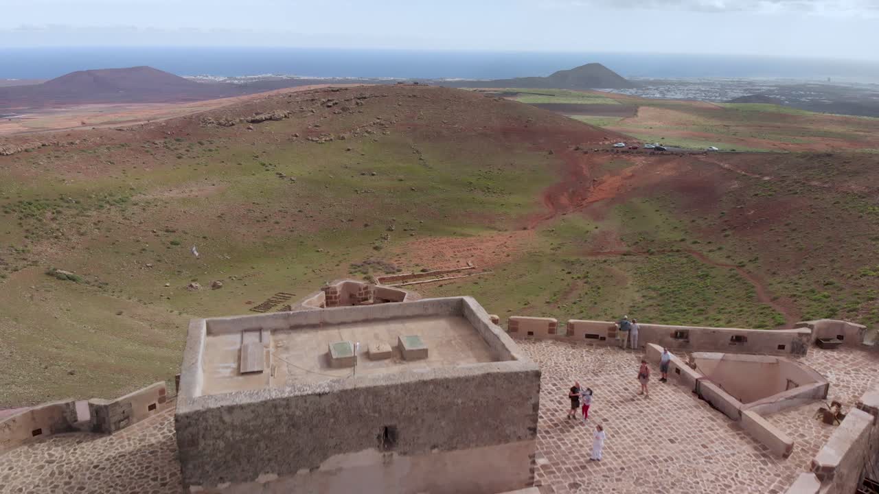 Descending Behind A Castle Built On The Rim Of A Volcano Free Stock ...
