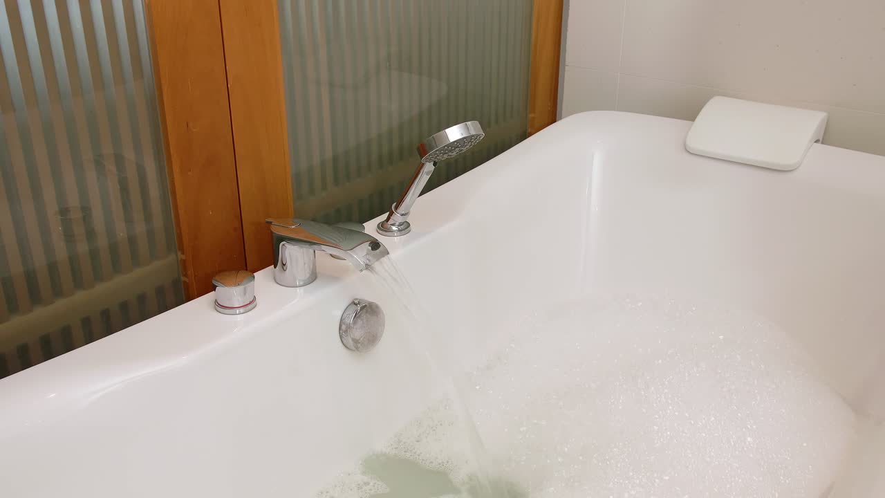 Women Preparation Of Taking Bath With Foam In Hotel And Testing Bathtub ...