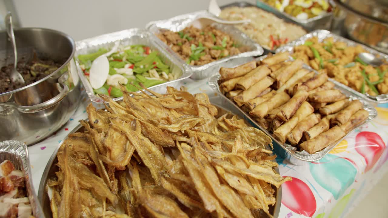 Premium stock video - A variety of asian filipino food at a potluck ...