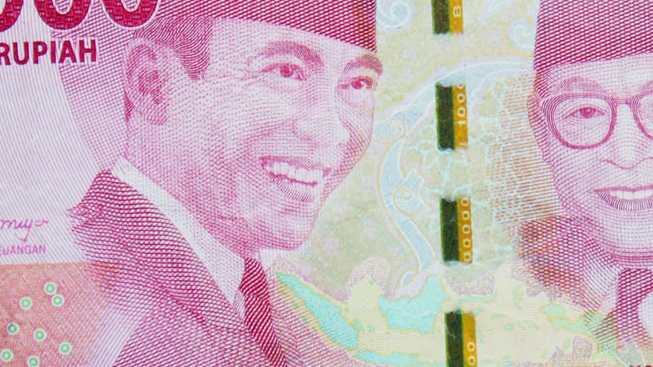 Premium stock video - Close-up shot of one hundred thousand indonesian ...