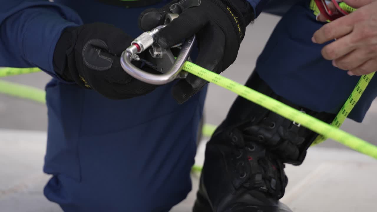 Firefighter Prepare Climbing Ropes With Safety Pulley And Carabiner ...