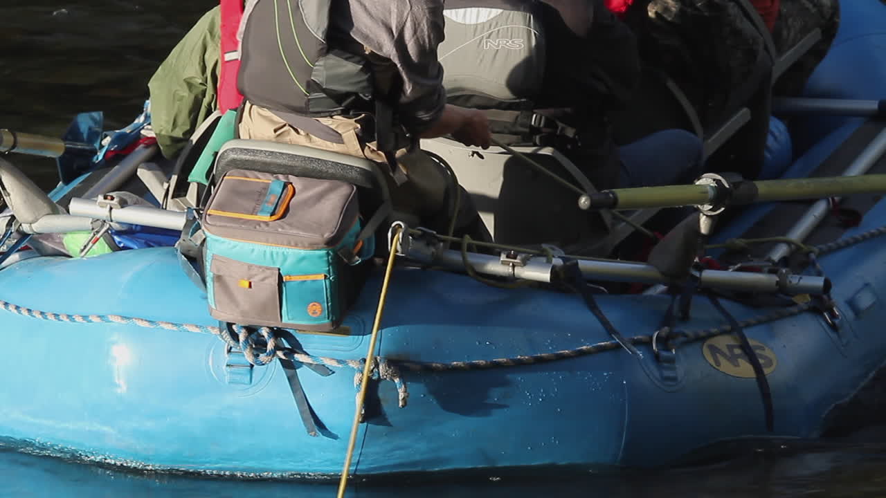Raft Guide Pulls Up Small Anchor On Blue NRS Inflatable River Raft Free ...