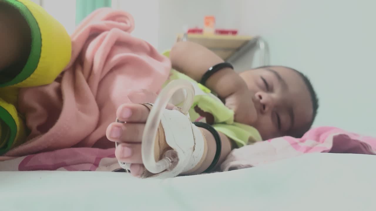 A Sick Child With Food Pipe Inserted In His Hand Sleeping In A Hospital ...