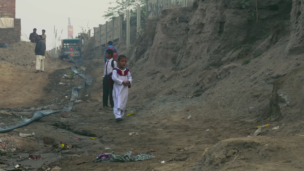 Pakistani Rural Area School Children In The Street In White Uniform, A ...