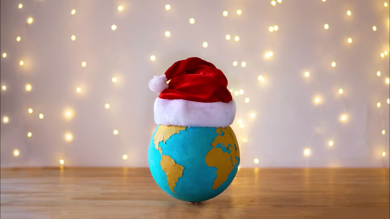 Beautiful Christmas animation of the Planet Earth wearing a Santa hat ...