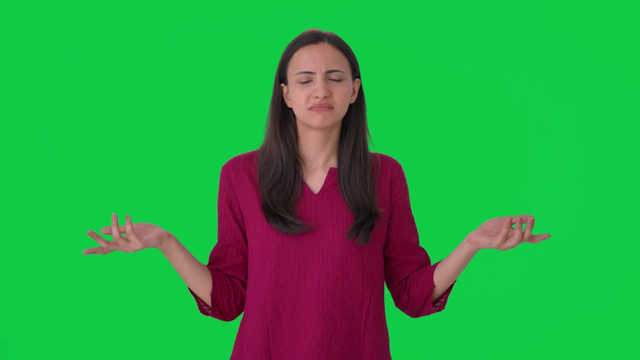 Premium stock video - Confused indian girl asking what question green ...