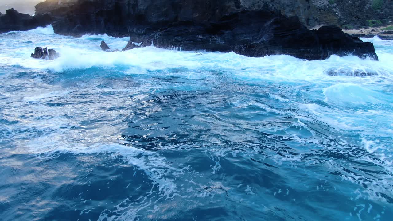 Drone Push In On Ocean Rocks As Rough Waves Crash On The Shore During A ...