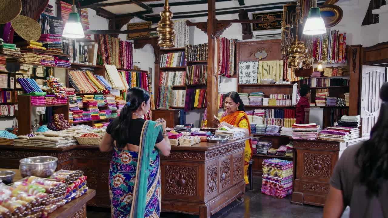 A vibrant textile shop with colorful fabrics, captured from a wide ...