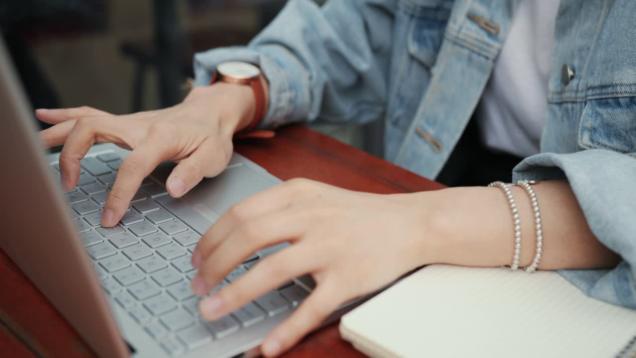 Close up of the female hands tapping and texting on the keyboard of ...