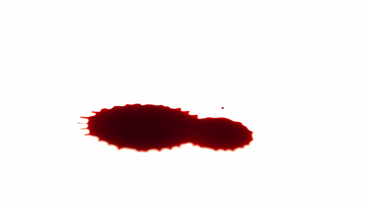 Blood dropping on white surface | Premium Stock Video Footage