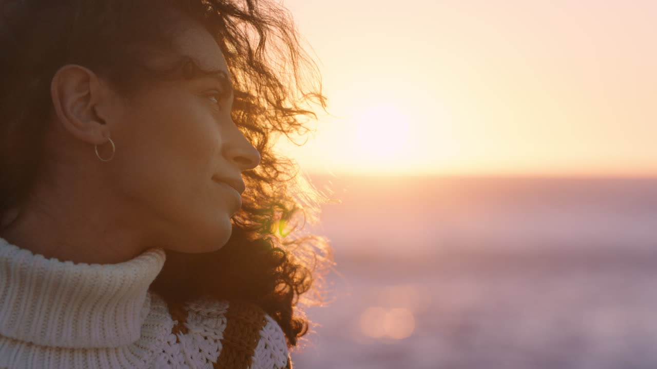 Portrait of beautiful hispanic woman enjoying peaceful seaside at ...