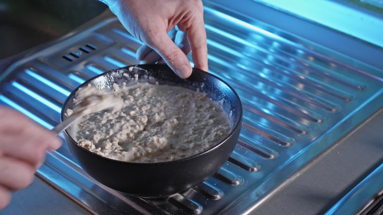 Stirring Oatmeal Mixture In A Ceramic Bowl Using Fork Free Stock Video ...