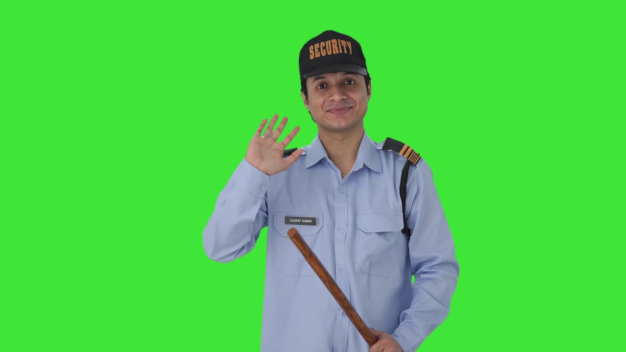 Happy Indian Security Guard Waving Hi To The Camera Green Screen Free ...