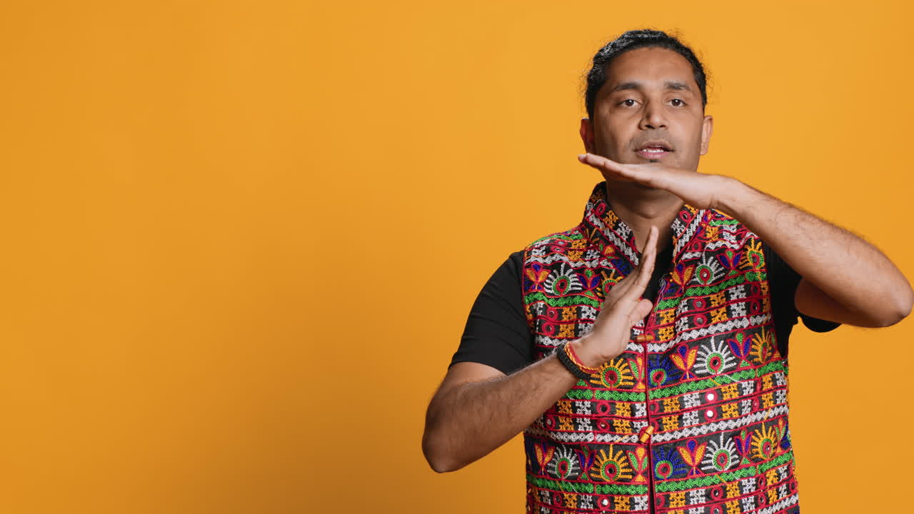 Premium stock video - Serious man requesting timeout, doing hand ...