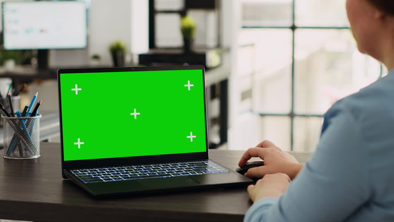 Premium stock video - Company specialist using laptop