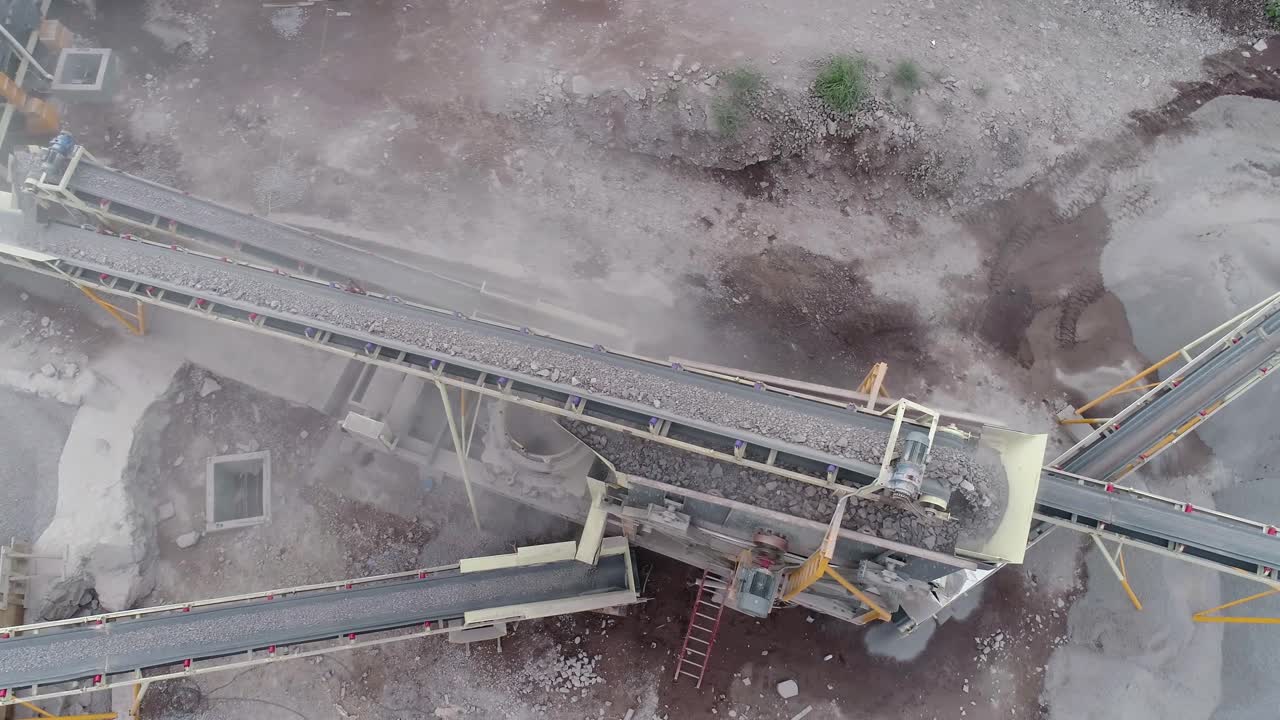 Premium stock video - Industrial machine pulverizing rock into ...