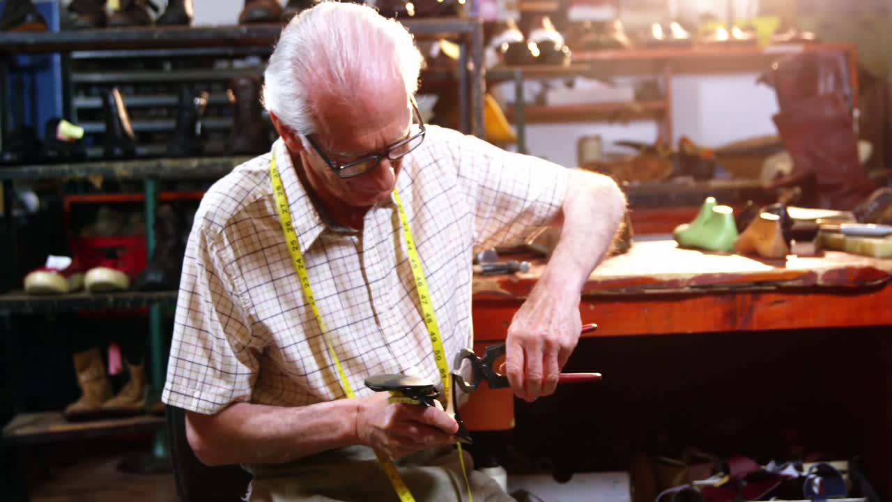 Shoemaker repairing a high heel | Premium Stock Video Footage