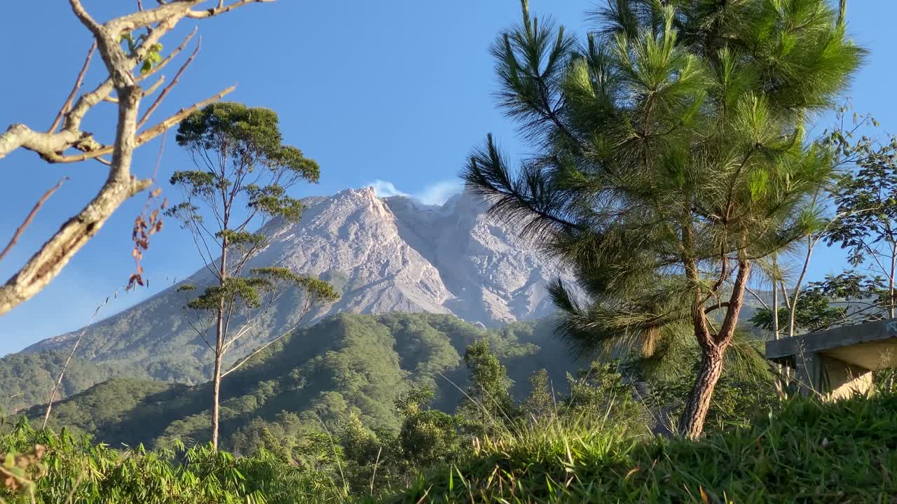 Morning view of mount merapi and clear blue sky Premium Stock Video Footage