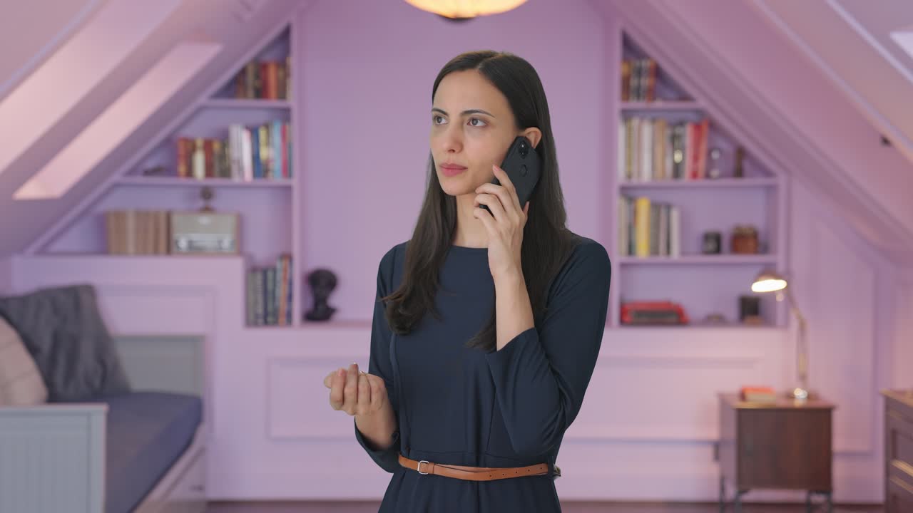 Premium stock video - Indian girl talking to someone on call