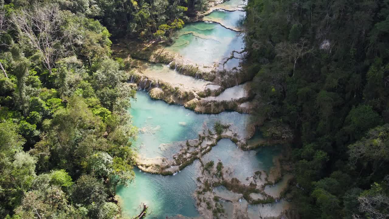 Premium stock video - Tourists swim in river gour pools of semuc ...