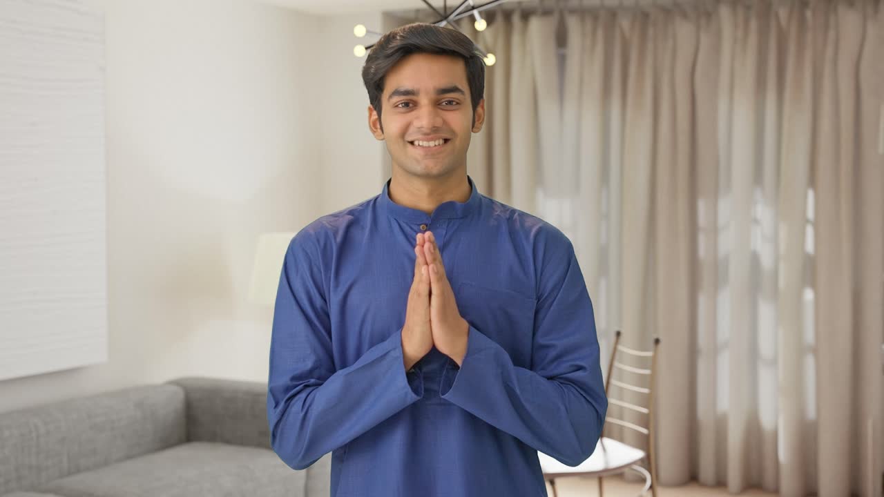 Premium stock video - Indian boy doing namaste and greetings