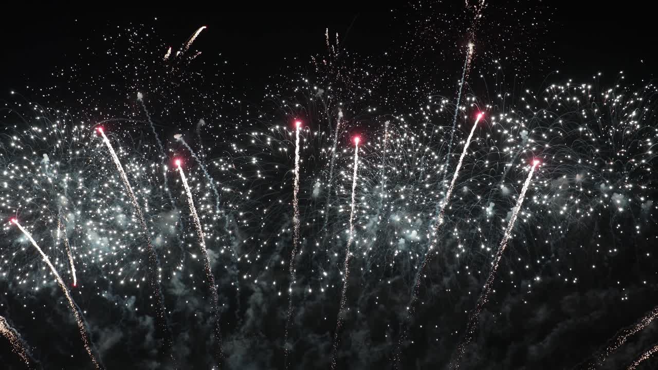 Premium stock video - Colorful fireworks exploding in the night sky ...
