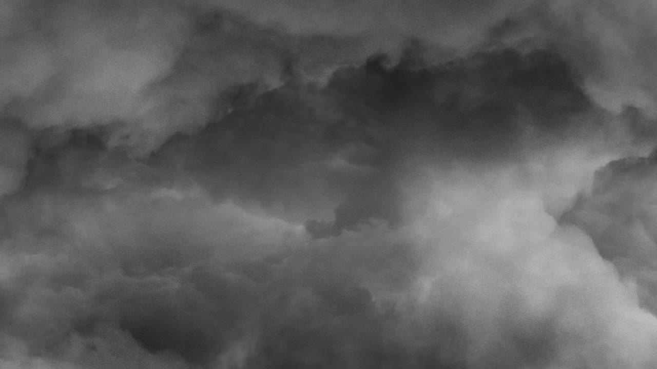 Premium stock video - A thunderstorm with moving dark gray clouds in the sky