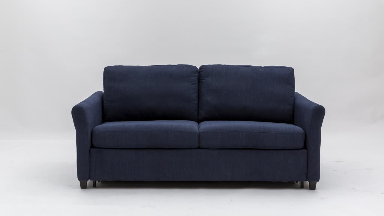 Camera slowly zooms in on blue fabric pull-out couch against white ...