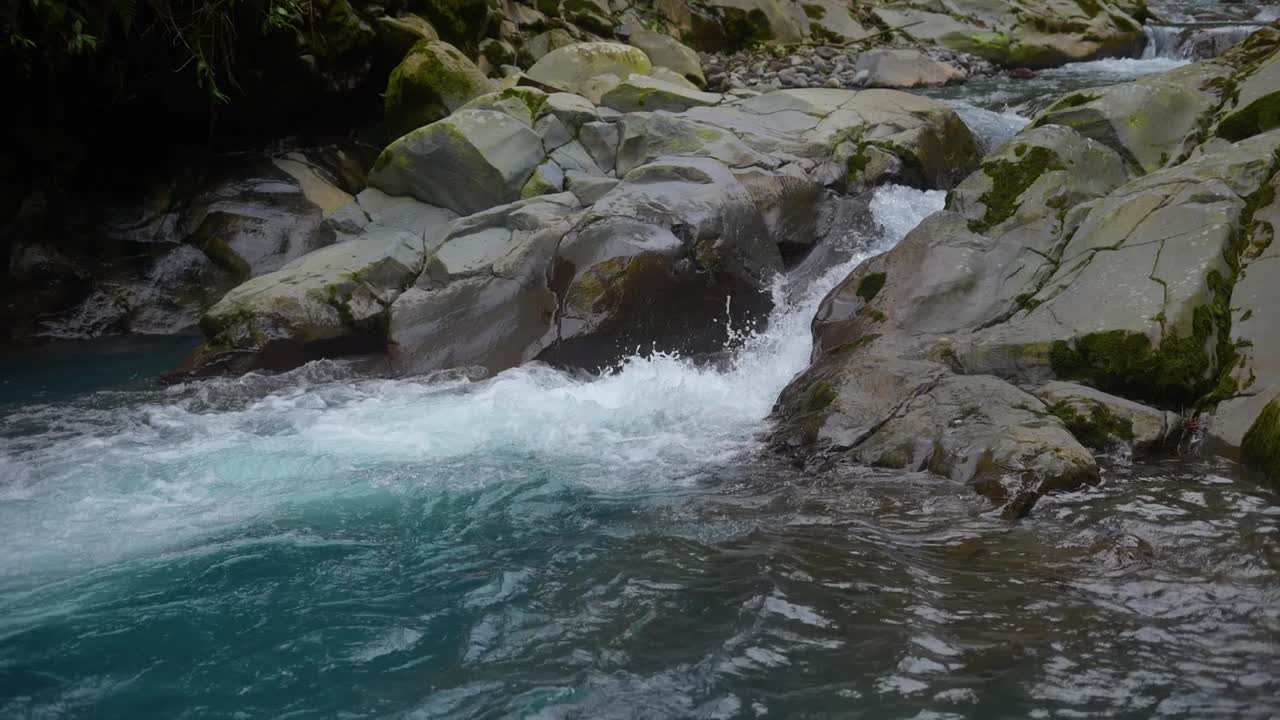 Creek With Crystal Clear Water Running Between Rocks In The Rainforest ...