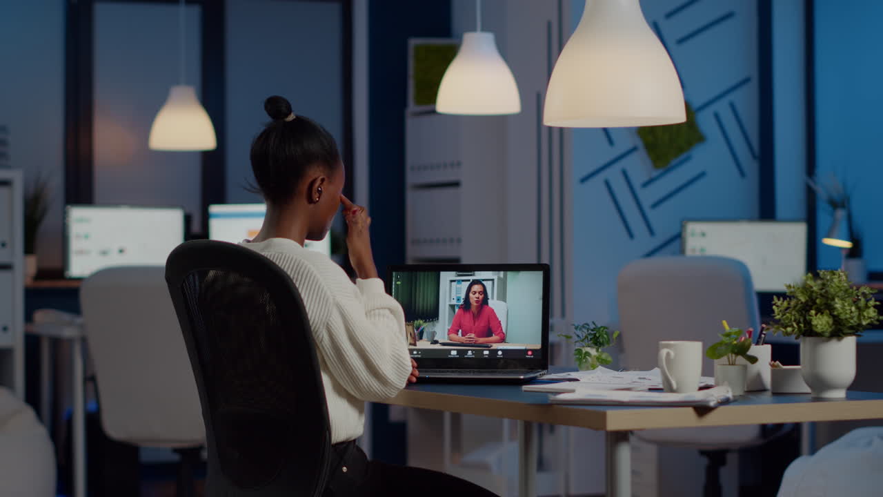 Premium stock video - African freelancer working remotely discussing ...