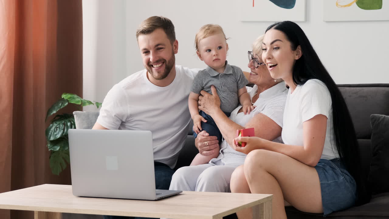 Free stock video - Happy family having a video call at home