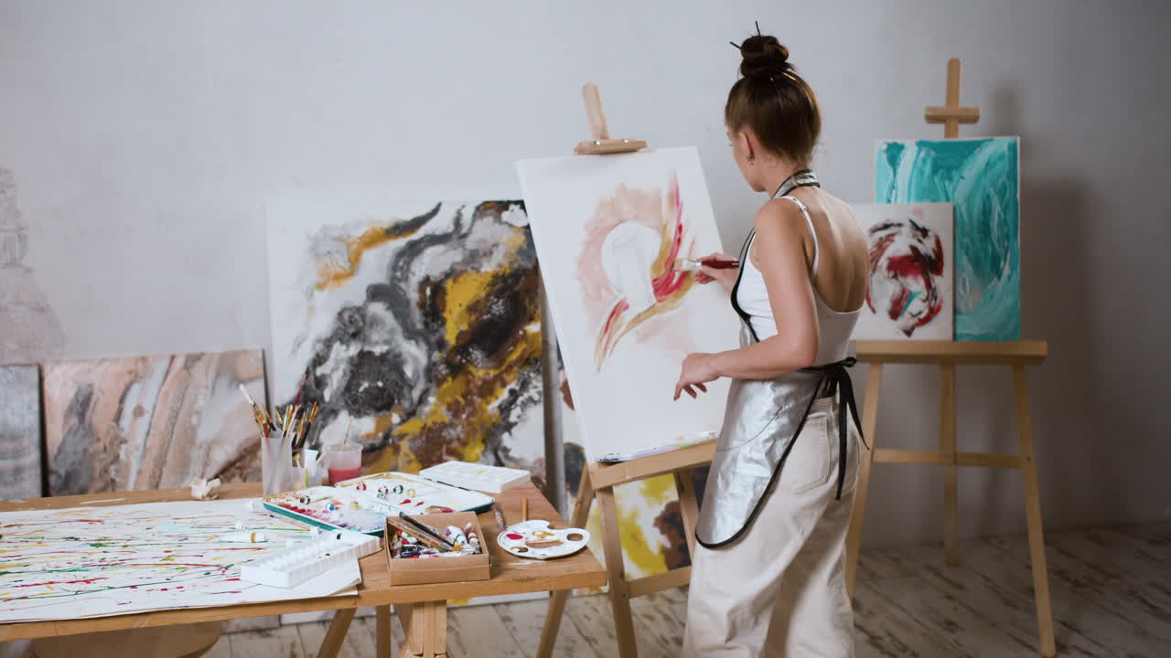 Free stock video - Artist creating a painting