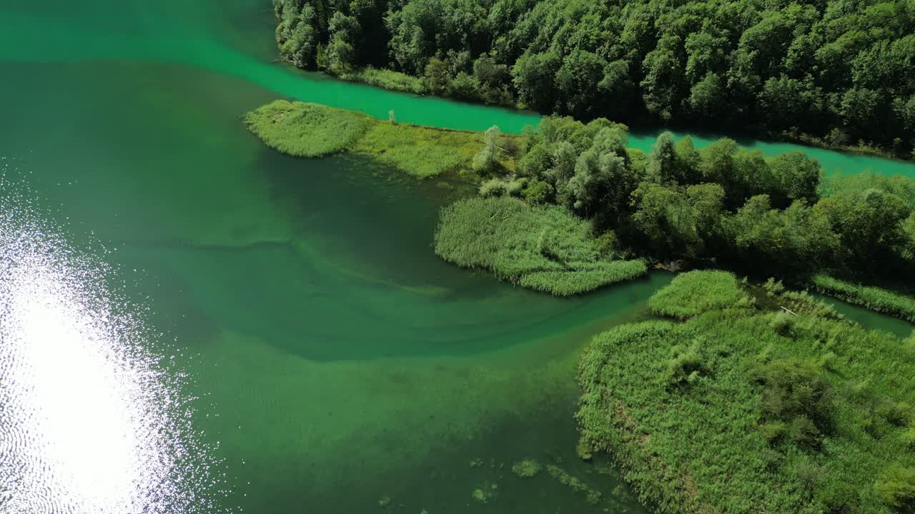 Pure green blue waters lake with tiny waves land turquois rivers of ...