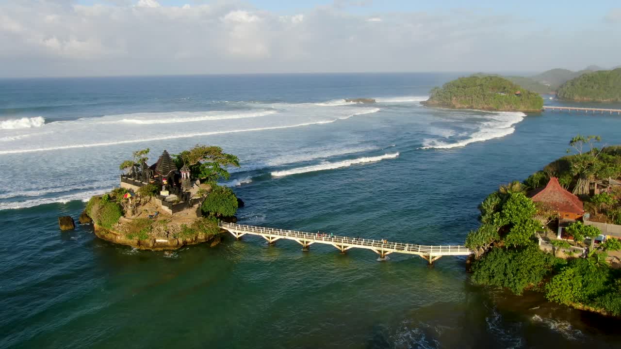 Picturesque balekambang hindu temple on rocky island on java coast ...